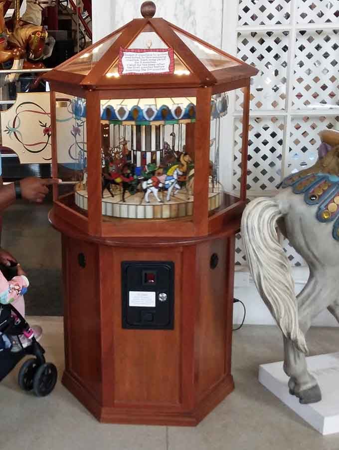 A miniature carousel that probably cost someone's weekly paycheck back when quarters actually meant something to kids.