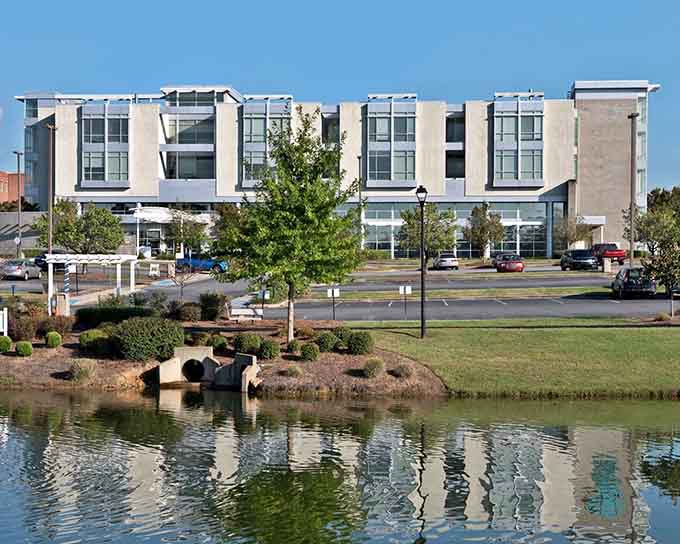 The modern library building sits lakeside, proving Milledgeville knows how to blend contemporary design with natural beauty.