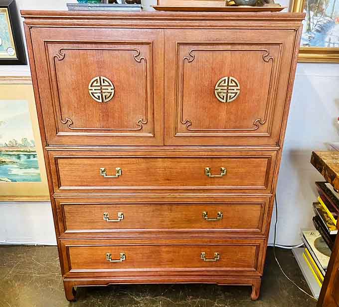 Asian-inspired cabinet with brass hardware that'll make your modern furniture feel deeply inadequate and mass-produced.