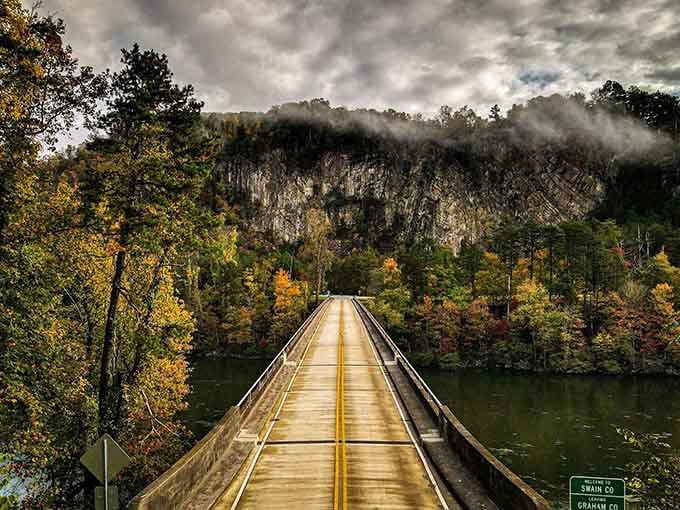 This bridge frames the cliffs like a postcard that somehow came to life right in front of your windshield.