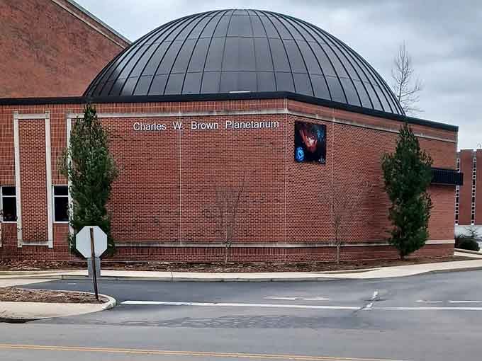 A striking domed ceiling crowns this brick planetarium, inviting you to step inside and explore the wonders of the universe.