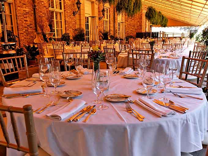 Tables set with enough elegance to make you forget someone's about to meet their fictional demise nearby.