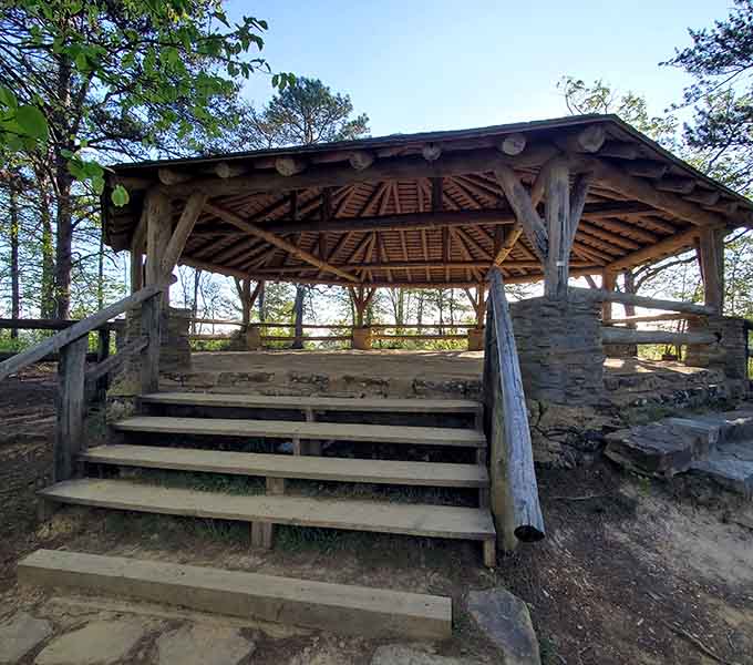 This rustic wooden pavilion offers the perfect spot to rest weary legs and contemplate the surrounding forest views.