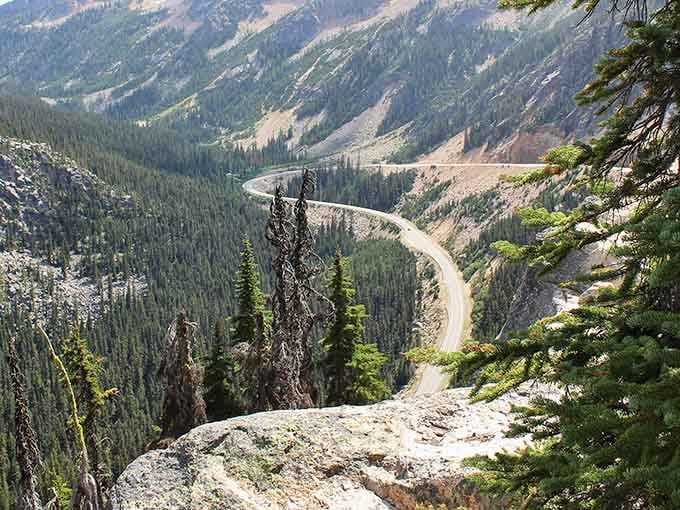 Switchbacks descending into valleys where the road seems to disappear into forests that go on forever.