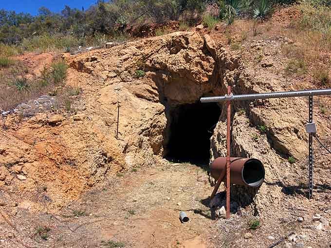 Another working tunnel entrance stands ready to yield its colorful secrets to those willing to dig deep.
