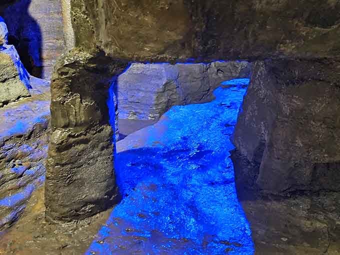 Blue pools reflect the cavern ceiling, doubling the visual impact of this underground natural wonder.