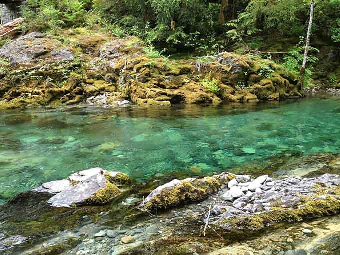Moss-covered boulders guard waters so pristine they make bottled water look like a complete amateur hour.