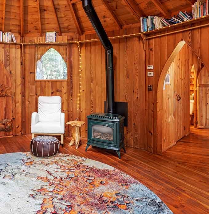 A wood stove for chilly evenings because sometimes the best entertainment is just watching flames dance while the forest whispers outside.