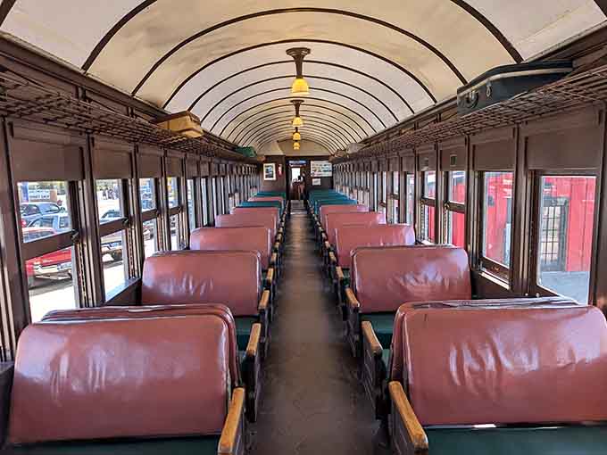Step inside these vintage cars where burgundy seats and arched ceilings transport you straight into a gentler era of travel.