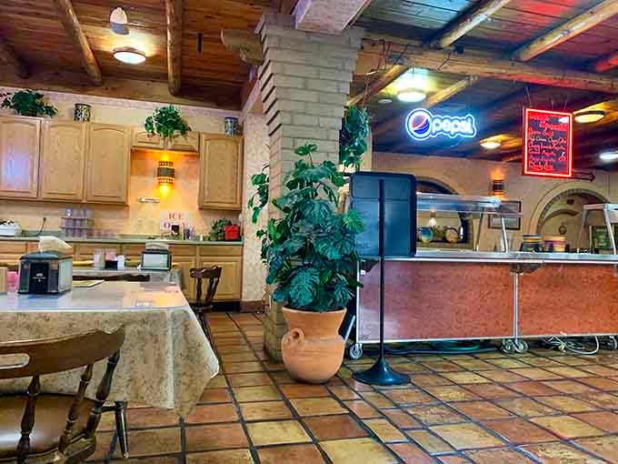 The dining area features exposed beams and warm lighting, creating an atmosphere as inviting as grandma's kitchen.