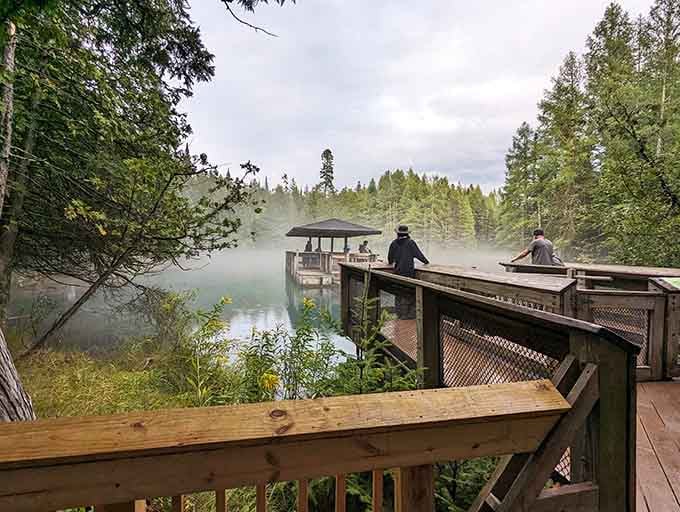 Morning mist rises from the spring's surface, creating atmospheric conditions that photographers dream about capturing.