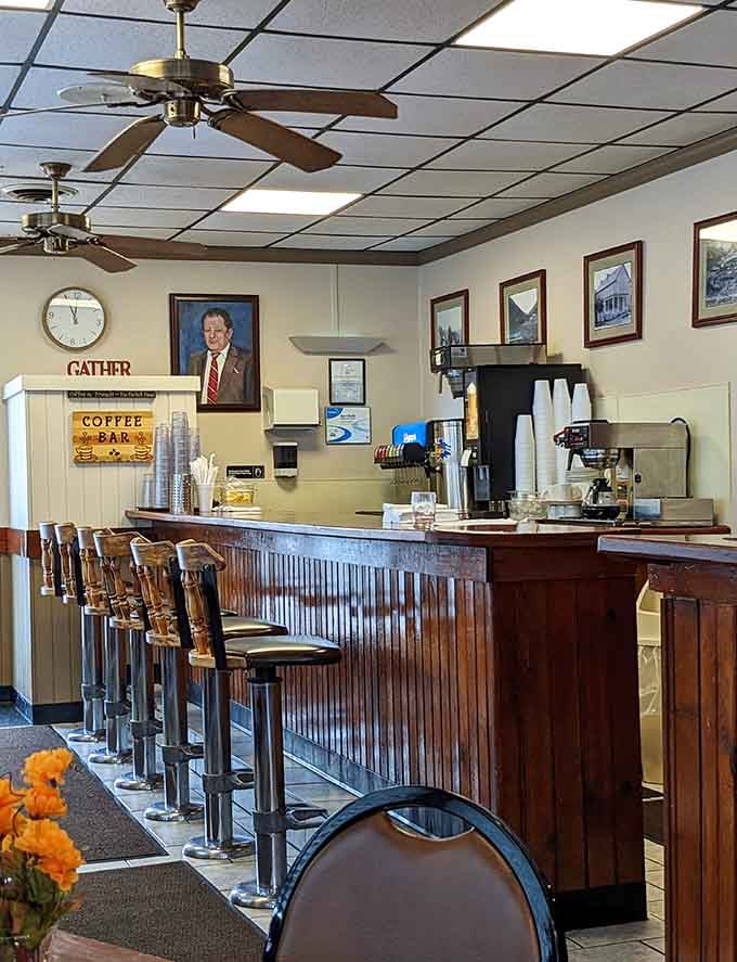 Counter seating with a coffee bar sign, where locals gather to solve the world's problems over endless refills.