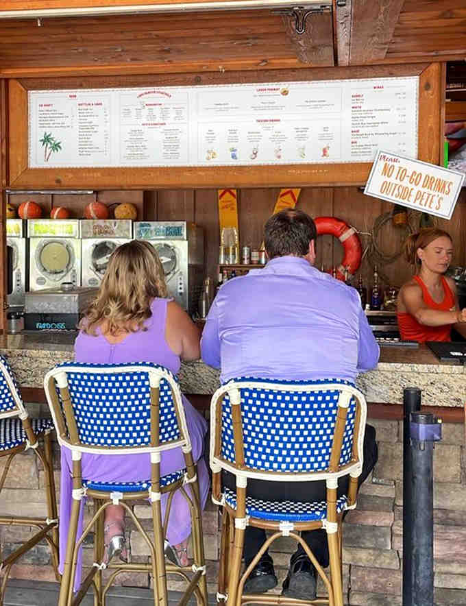 Bar staff mixing drinks with the enthusiasm of people who genuinely enjoy making strangers ridiculously happy.