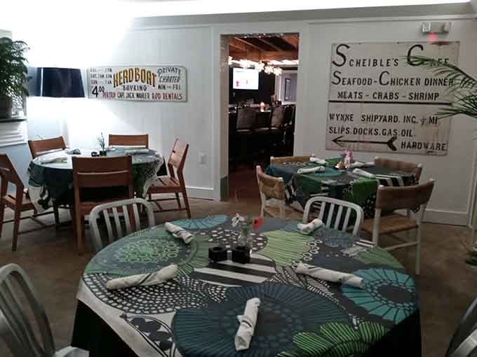 Vintage signage pointing to long-gone local businesses adds authentic Chesapeake character to the bright, airy dining space.