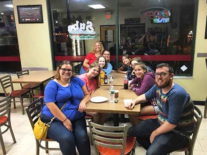 Nothing says "this place is legit" quite like a table full of happy diners sharing laughs and pizza together.