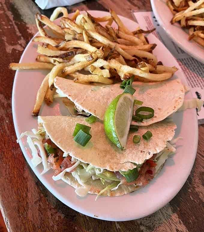 Mahi-mahi tacos with that perfect pink sauce prove the ocean's bounty pairs beautifully with literary genius.