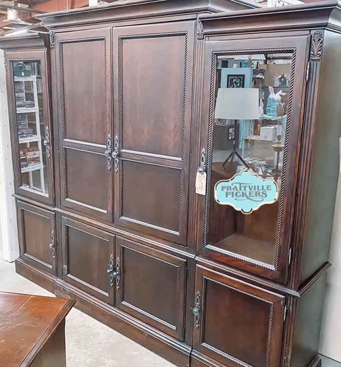 Solid wood cabinet with rope detailing and glass doors, proving furniture used to be built for generations, not years.