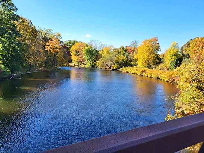 Fall colors reflecting on the Quinebaug River create a masterpiece that changes daily, free admission included.