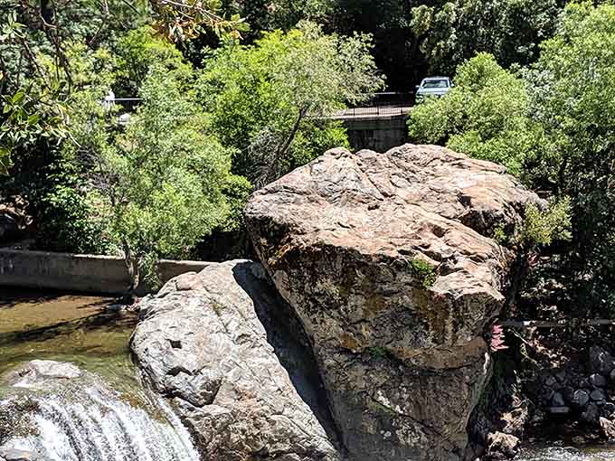 Ancient boulders frame the scene like nature's own sculpture garden, each one positioned by geological happenstance over eons.