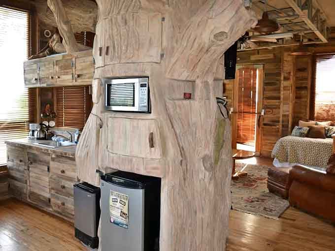 Modern appliances tucked into rustic cabinetry prove that convenience and charm can absolutely coexist in perfect harmony.