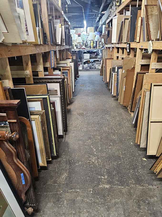 Picture frames line the aisles like an art supply store merged with a flea market's greatest hits section.