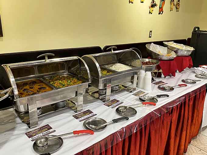 The buffet station stands ready for action, steam trays filled with possibilities and your appetite's wildest dreams coming true.