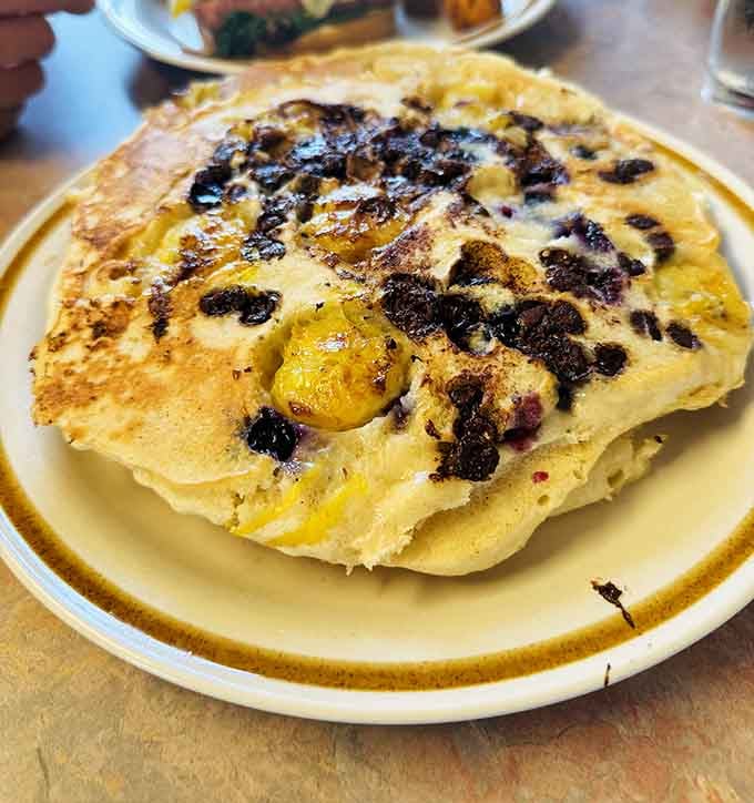 Those chocolate chip pancakes achieve the impossible: crispy edges meeting fluffy centers in perfect breakfast harmony every single time.
