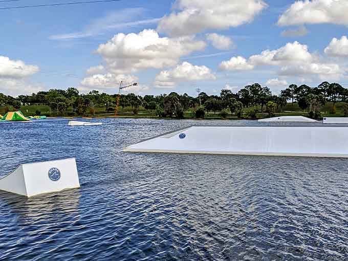 Smooth wakeboarding area where the cable system pulls riders around the lake with impressive consistency and occasional comedy.