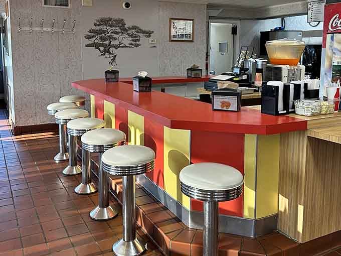 Classic counter stools where you can sit and contemplate life's simple pleasures, like really exceptional broasted chicken.