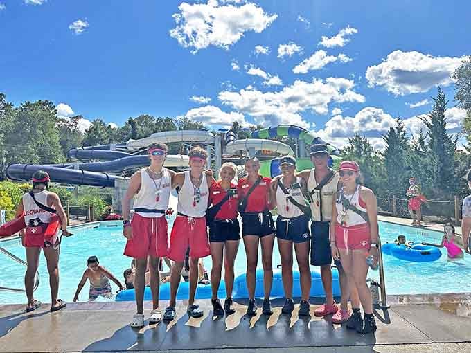 Lifeguards pose with confidence, the unsung heroes who keep chaos organized and everyone safely splashing along.
