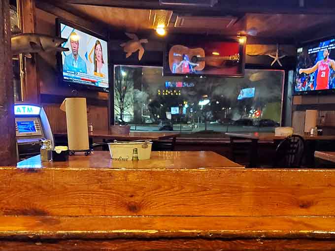 The bar area stays lively with multiple screens, making it ideal for catching the game over cold drinks.