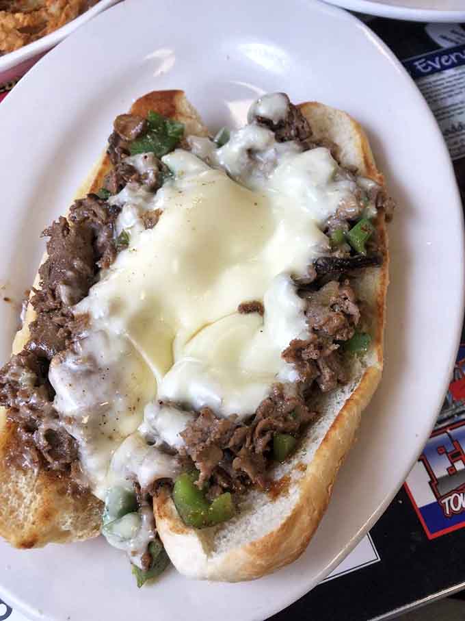 Philly cheesesteak loaded with tender beef, melted cheese, and peppers, bringing a taste of Pennsylvania to Georgia soil.