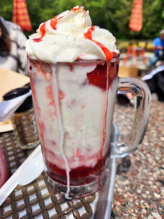 Strawberry shakes topped with whipped cream and syrup look like they escaped from a Norman Rockwell painting, deliciously.