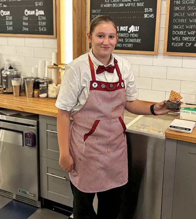 That red-striped apron and genuine smile? That's the uniform of happiness, served fresh daily.