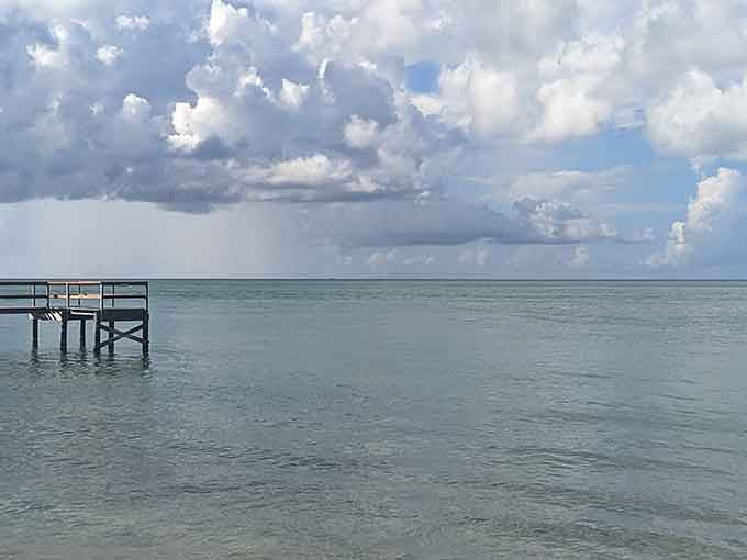 Storm clouds rolling in over calm waters create drama worthy of a prestige television series finale scene.