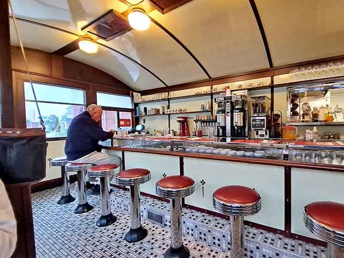 A customer enjoying their meal at the counter proves that solo dining here is perfectly acceptable therapy.