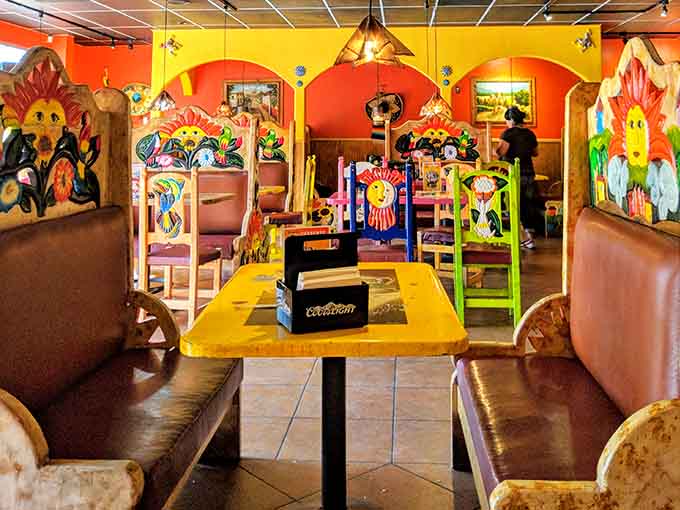 Colorful booth dividers featuring hand-painted artwork that transforms your meal into a truly immersive cultural experience here.