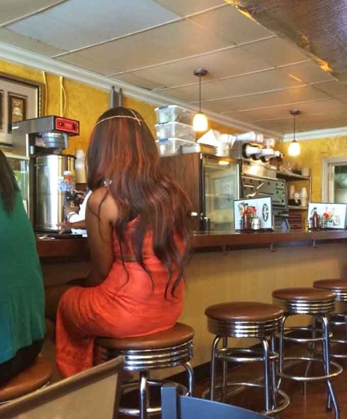 Counter seating offers front-row views to the cafeteria line where all your Southern food dreams come gloriously true.