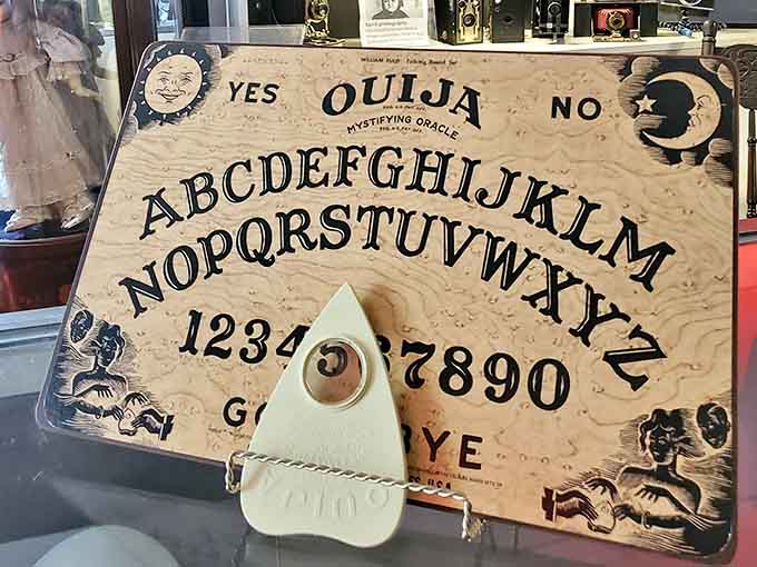 The Ouija board sits behind glass for good reason, because some conversations with the other side should remain strictly supervised and controlled.