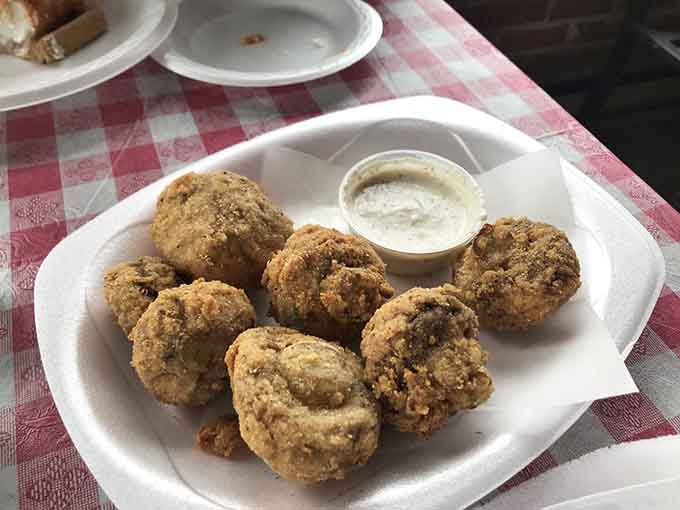 Fried mushrooms that look like golden nuggets of joy, because sometimes you need a vegetable that's been properly introduced to hot oil.