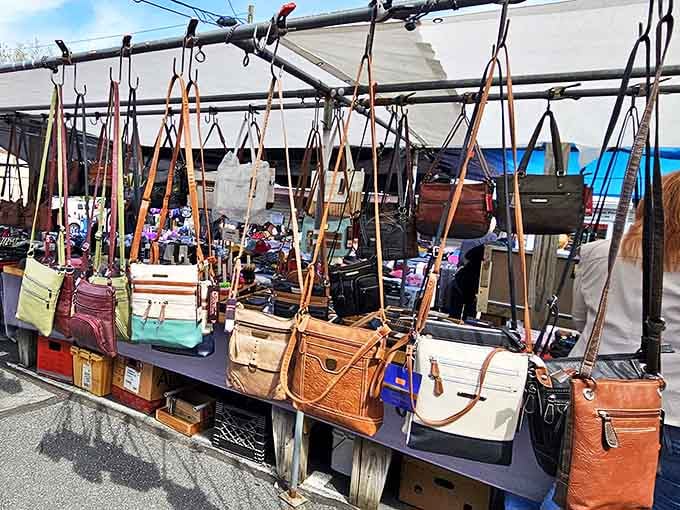 Leather purses dangling in rows, offering more bag options than you knew existed outside a department store.
