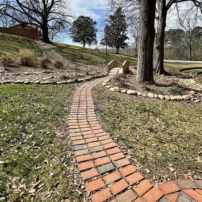 The brick walkway leads you toward the labyrinth like a red carpet rolled out for your personal journey inward.
