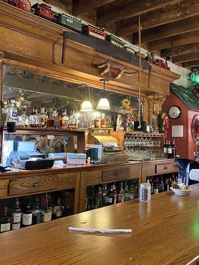 The bar area blends rustic charm with practical service, complete with vintage toys watching from above.