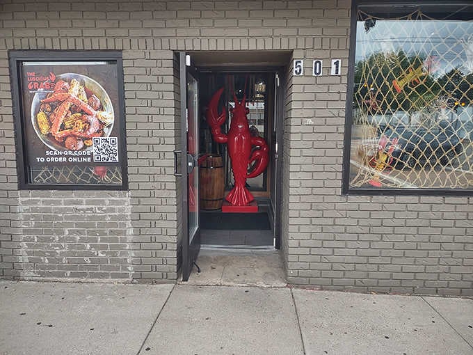 That bright red lobster statue guards the entrance, welcoming seafood pilgrims to their landlocked ocean paradise destination.