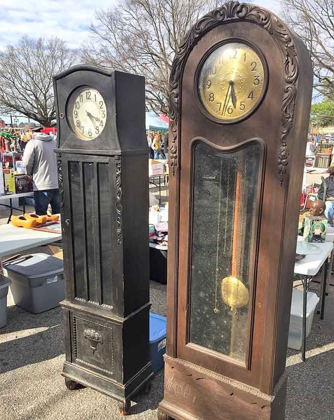 Vintage grandfather clocks standing at attention, still keeping time like the reliable sentinels they've always been.