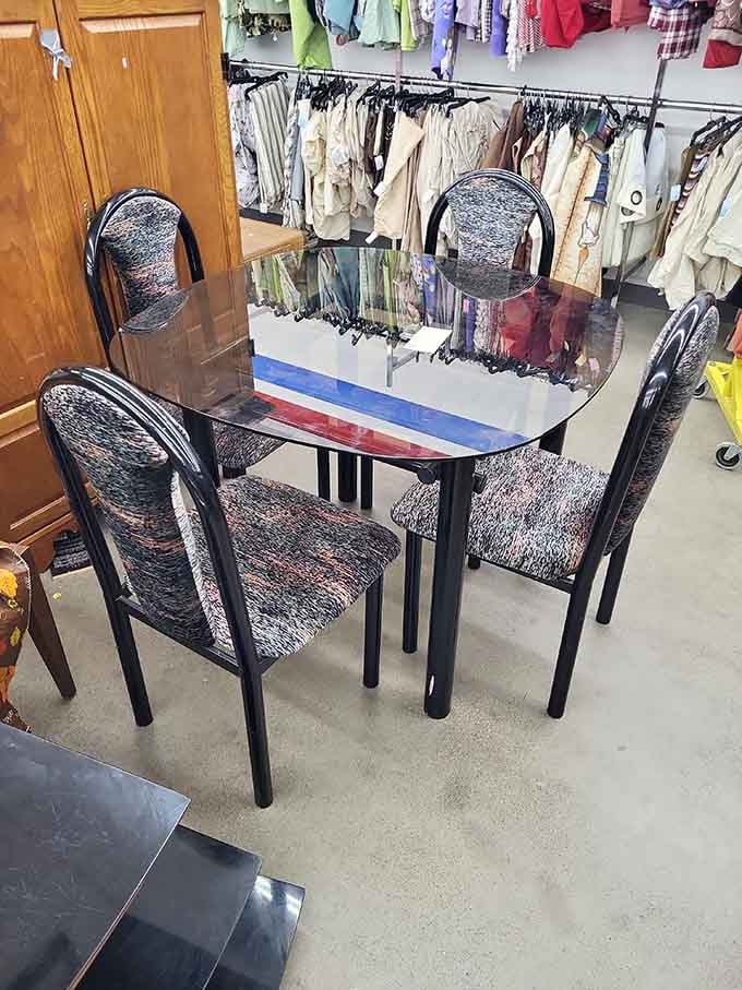 This glass-topped dining set is ready to host dinners where everyone pretends they didn't find it thrifting.