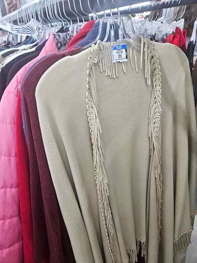 That fringe cardigan is giving serious bohemian vibes and whispering "you know you want to try me on."