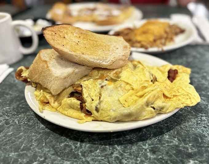 This omelet is so stuffed with bacon and cheese, it's practically auditioning for a role in your food dreams tonight.
