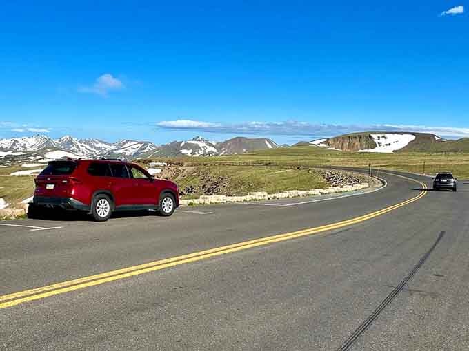 Sweeping tundra landscape stretches endlessly under big sky, where the horizon seems close enough to touch from your driver's seat.