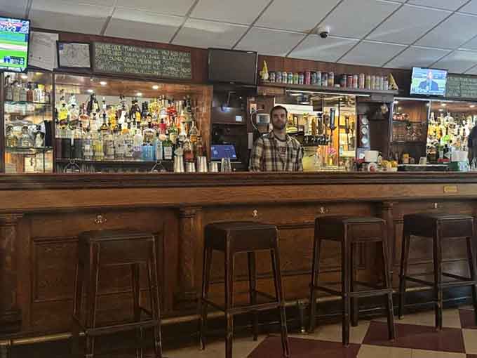 The well-stocked bar where locals gather to discuss life's important questions, like Zesty versus Prohibition sauce preferences.